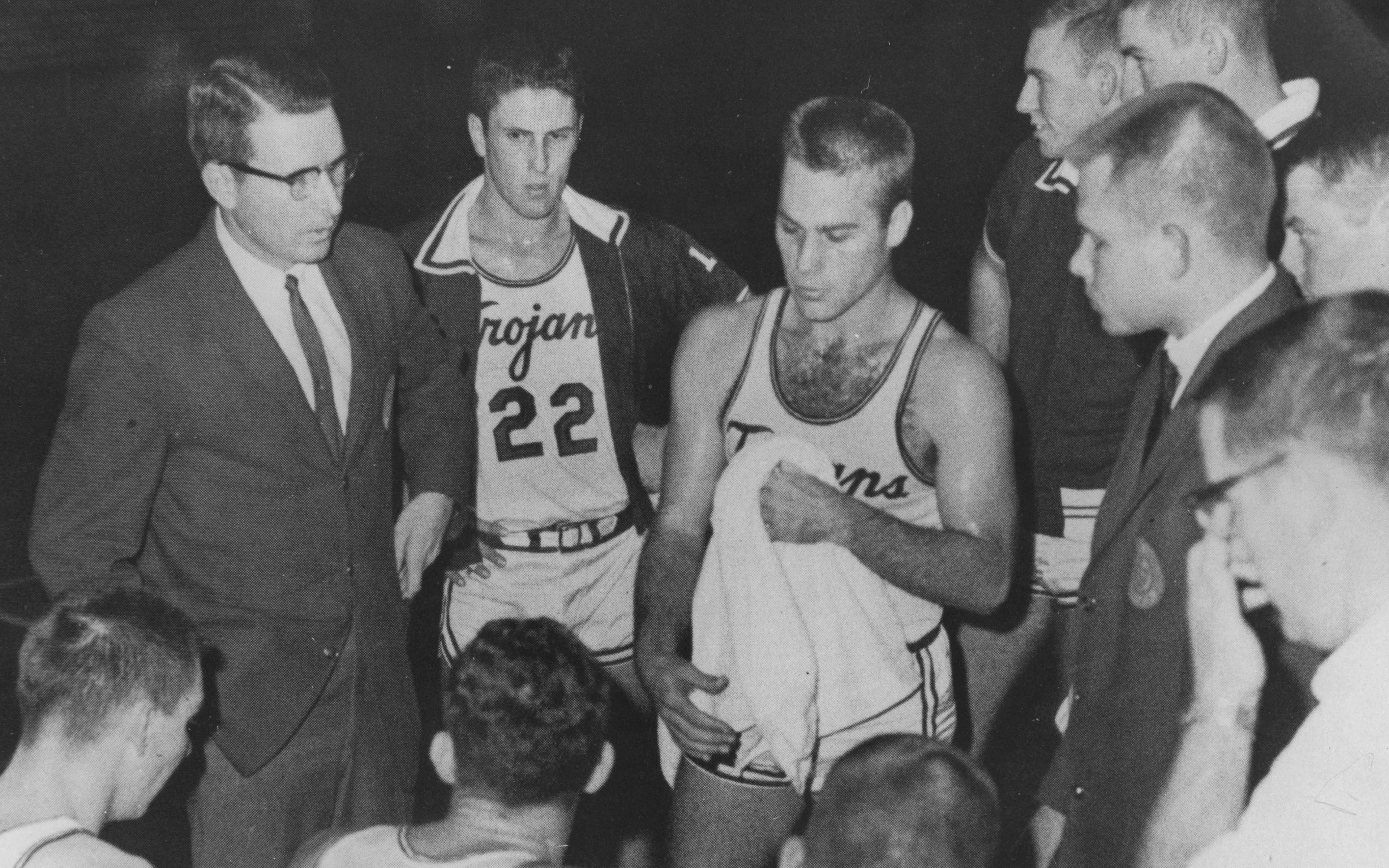 Trojan Basketball Coach Bill Ballard (left) discusses strategy with ...